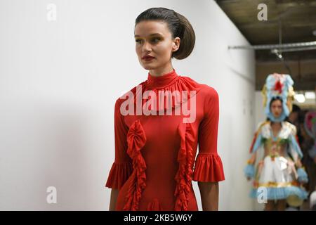 Models are seen in the backstage prior to the FAD catwalk during London ...