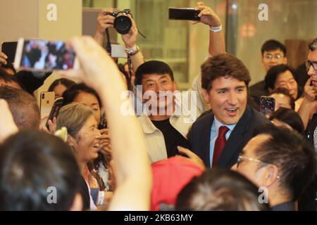 Justin Trudeau is greeted by supporters during an election rally in ...
