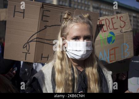 Masked students seen during Youth strike for the climate in Warsaw on ...