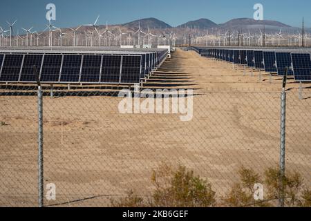 Solar farms and wind farms in the desert outside Mojave, California ...