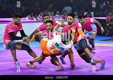 Players of Puneri Paltan (white) and Jaipur Pink Panthers (Pink) in action during the Pro ...