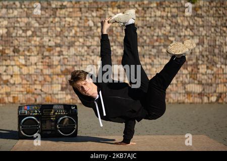 Breakdance dancer.A boy in breakdance position. A dancer in a difficult ...