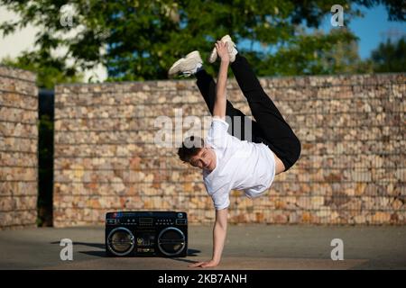 Breakdance dancer.A boy in breakdance position. A dancer in a difficult ...
