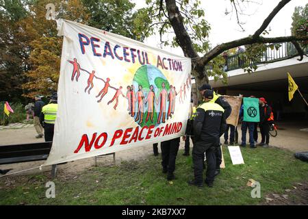 Dutch anti-riot police officers hold dogs advance to evacuate ...