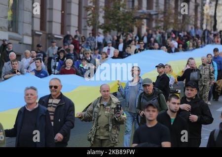 Ukrainians participate a march under the flags of far-right Svoboda ...