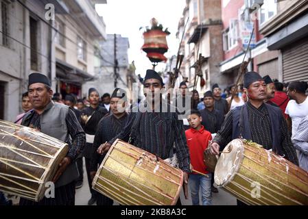 Devotees carry the chariot of Lord Narayan during the festival. The ...