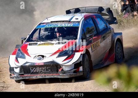 Japanese rally driver Takamoto Katsuta (C) makes a race strategy plan ...
