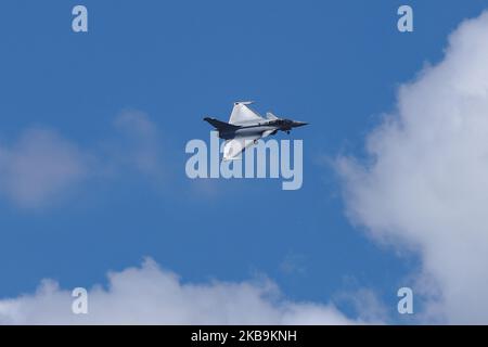 A pilot is seen in a Rafale fighter jet, after landing in Tanagra Air ...