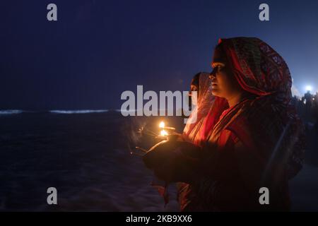 Devotees are waiting for the first light of Sun 'Surya' god to complete ...