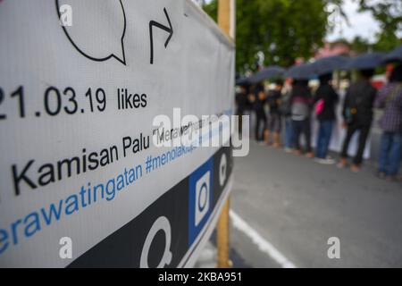 Humanitarian activists carry banners at the Kamisan Action in front of ...