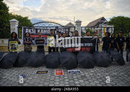 Humanitarian activists carry banners at the Kamisan Action in front of ...