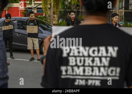 Humanitarian activists put on their faces and carried pamphlets when ...