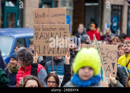 Signs reading " We need a radical green Climate policy ". As in ...
