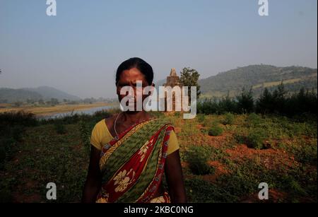 Villagers are seen inside the Balimela reservor as they moves out by ...