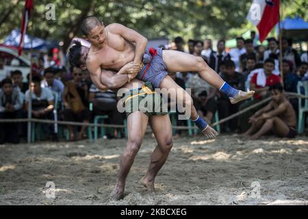 Wrestlers compete in a Rakhine traditional wrestling known as â€œKyinâ ...