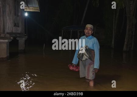 This photo shows a portrait residents of flood victims who survived and ...