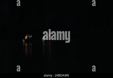 A group of Nepalese people sailing boat on Kupinde Lake at Salayan ...