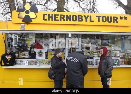 Visitors stand next to a souvenir shop on the Dytyatky checkpoint in ...