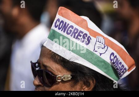 Supporters of India's main opposition Congress party hold placards and ...
