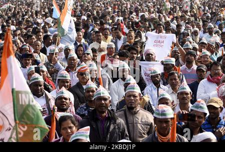 Supporters of India's main opposition Congress party holds placards and ...