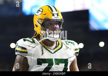 Green Bay Packers' Billy Turner wear a Crucial Catch headband as he ...