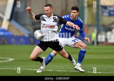 Tomas Egert of Oldham Athletic and Adam Rooney of Salford City during ...