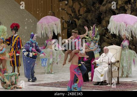 Pope Francis looks at artists of the "Aqua" Cuban circus during his ...