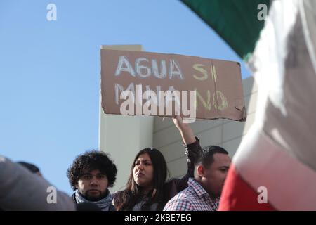 An activist protests against the copper exploitation project at the ...