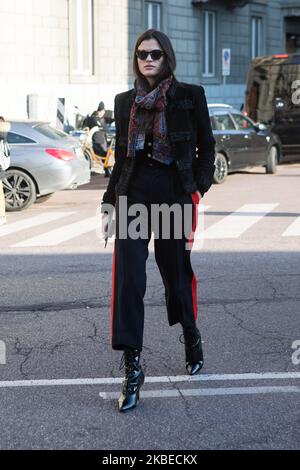 Guest arrives at Salvatore Ferragamo fashion show during the Milan ...