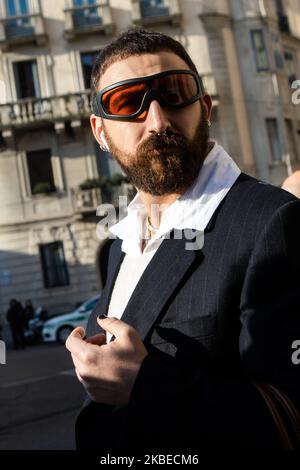 Guest arrives at Salvatore Ferragamo fashion show during the Milan ...