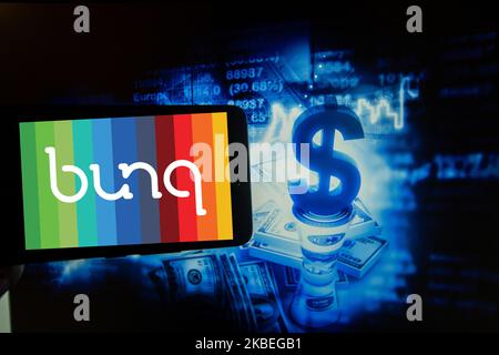 The logo of Bunq is seen on a screen of a smartphone next to an ...