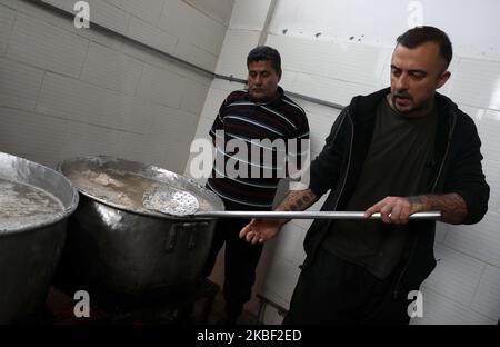 Gabriele Rubini (L), known as Chef Rubio, cooks with Palestinian ...