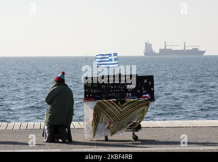 People enjoy the seafront promenade of Thessaloniki, Greece on January ...