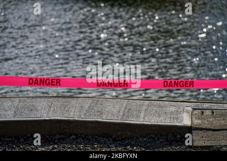 Warning Notice Danger Jetty Unsafe Keep Out refers to the old wooden ...