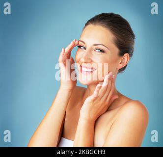 It feels good and so do I. Studio portrait of a beautiful young woman ...