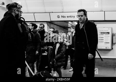 People are seen as they commute at Holborn Station, London on February ...