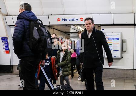 People are seen as they commute at Holborn Station, London on February ...