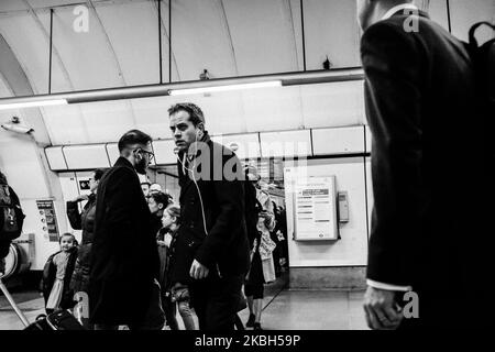 People are seen as they commute at Holborn Station, London on February ...