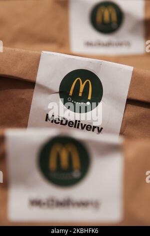 In this photo illustration, McDonald's logo is displayed on a ...
