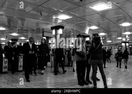 People are seen as they commute at Piccadilly Circus station on ...