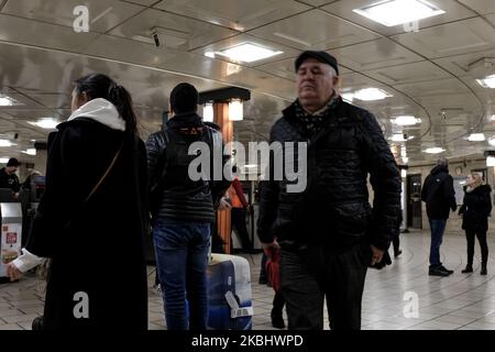 People are seen as they commute at Piccadilly Circus station on ...