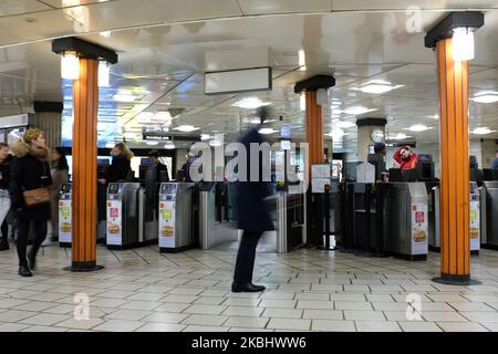 People are seen as they commute at Piccadilly Circus station on ...