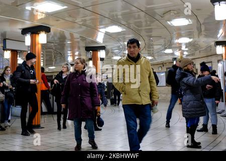 People are seen as they commute at Piccadilly Circus station on ...