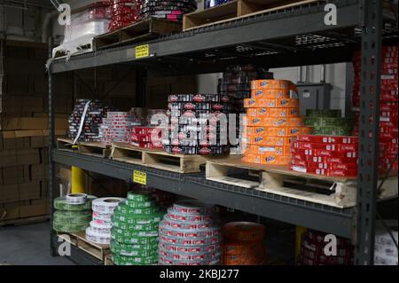 Labels for Coca-Cola products lay on a shelf in the bottling facility ...