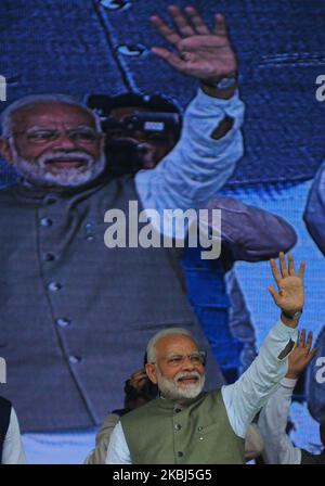 Prime Minister Narendra Modi waves to supporters during a Public ...