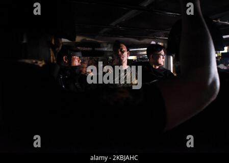 Police officers secure the suspect outside a mall in San Juan City ...