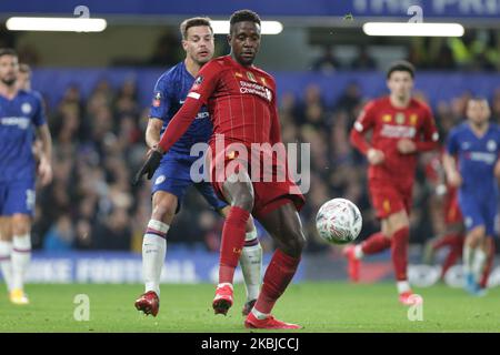 Divock Origi of Liverpool holding off Cesar Azpilicueta of Chelsea ...