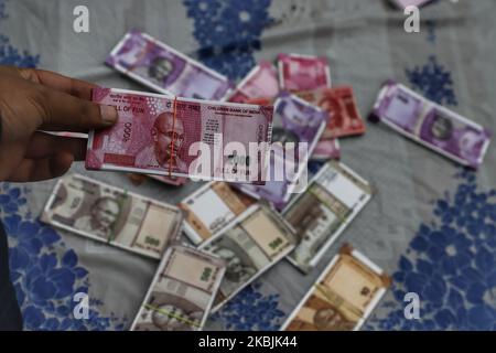 A vendor sells fake notes of Indian currency of Rs 50, Rs 100, Rs 500 ...
