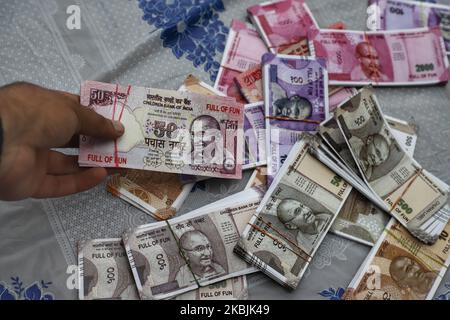 A vendor sells fake notes of Indian currency of Rs 50, Rs 100, Rs 500 ...