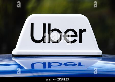 Uber sign is seen on the car in Krakow, Poland on March 10, 2020 ...
